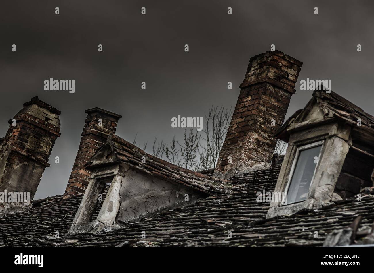 Old house with many chimneys hi-res stock photography and images - Alamy