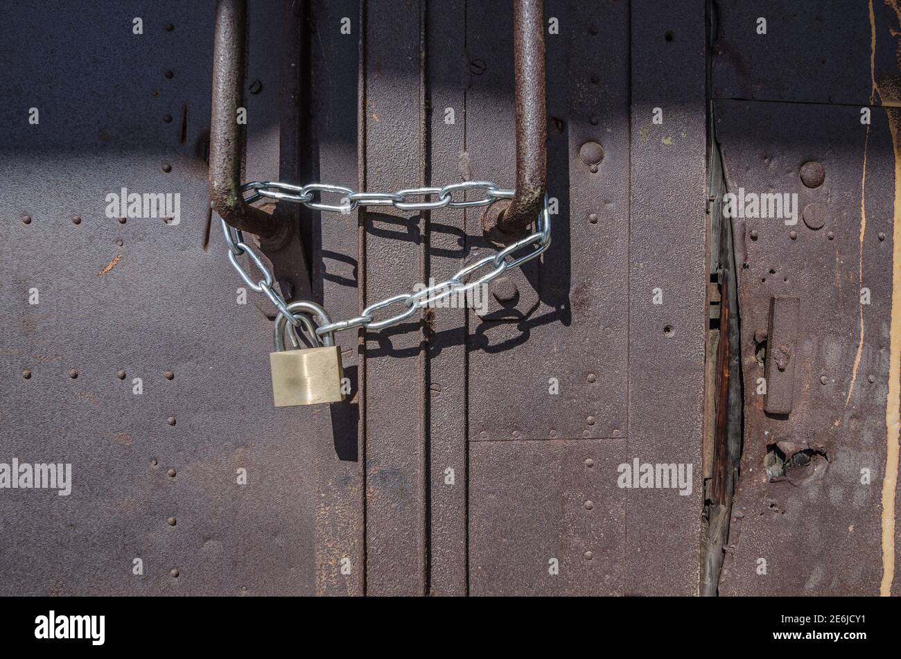 chain and padlock iron door Stock Photo - Alamy
