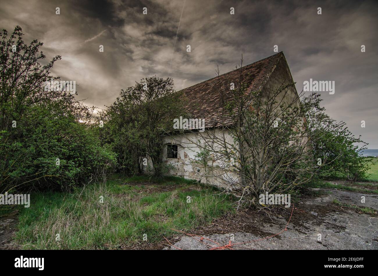 old house with dark rain clouds Stock Photo - Alamy