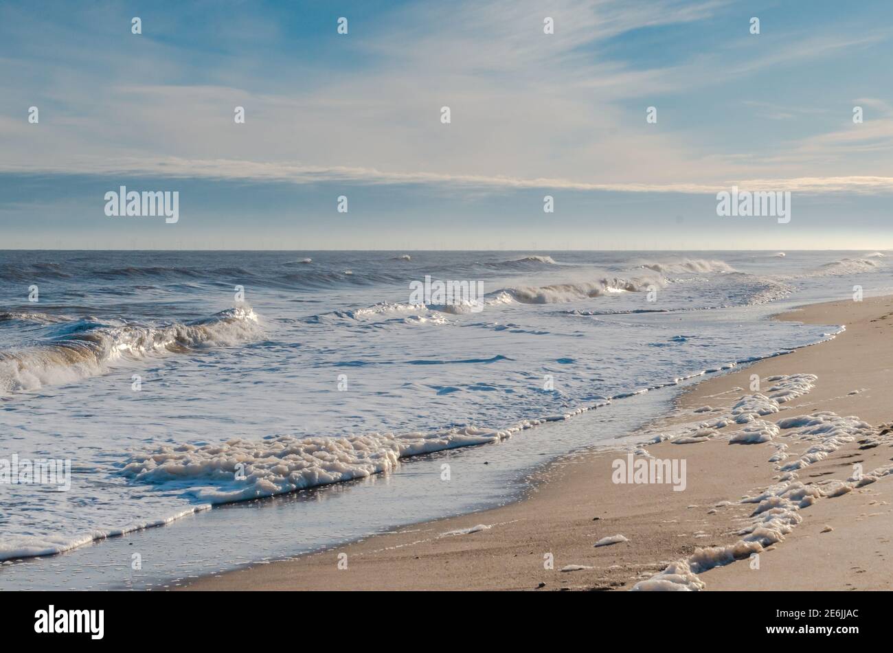 Waves on sandy sea beach hi-res stock photography and images - Alamy