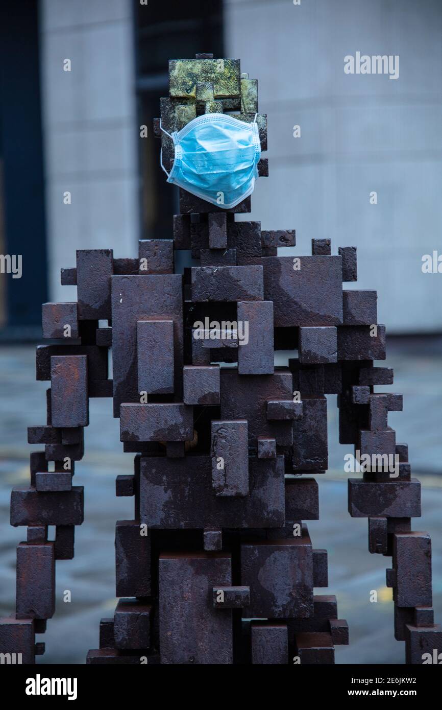 The Antony Gormley Statue "Resolution" wearing a Covid-19 mask, St ...