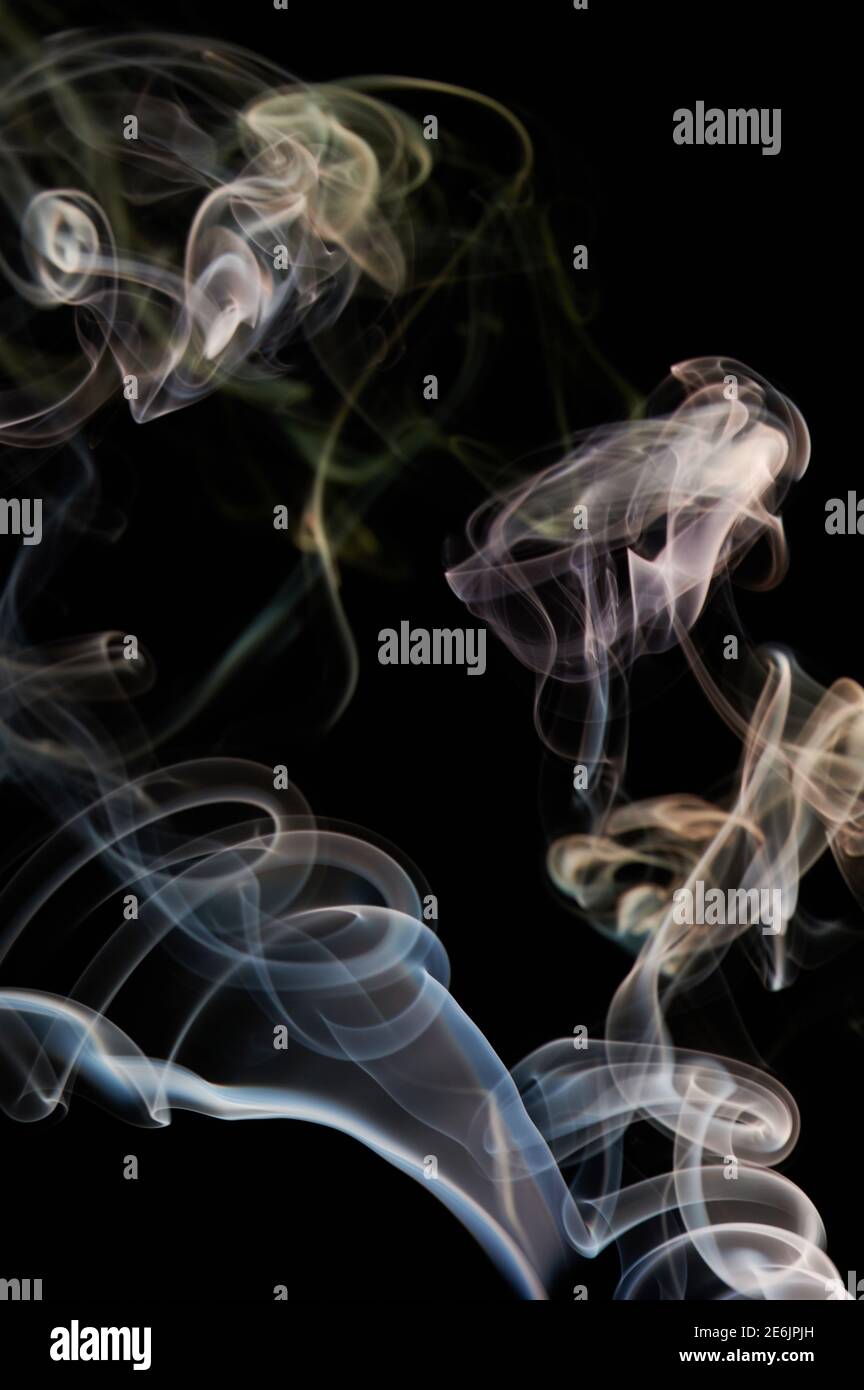 Elegant curly transparent smoke swirls on black background Stock Photo ...
