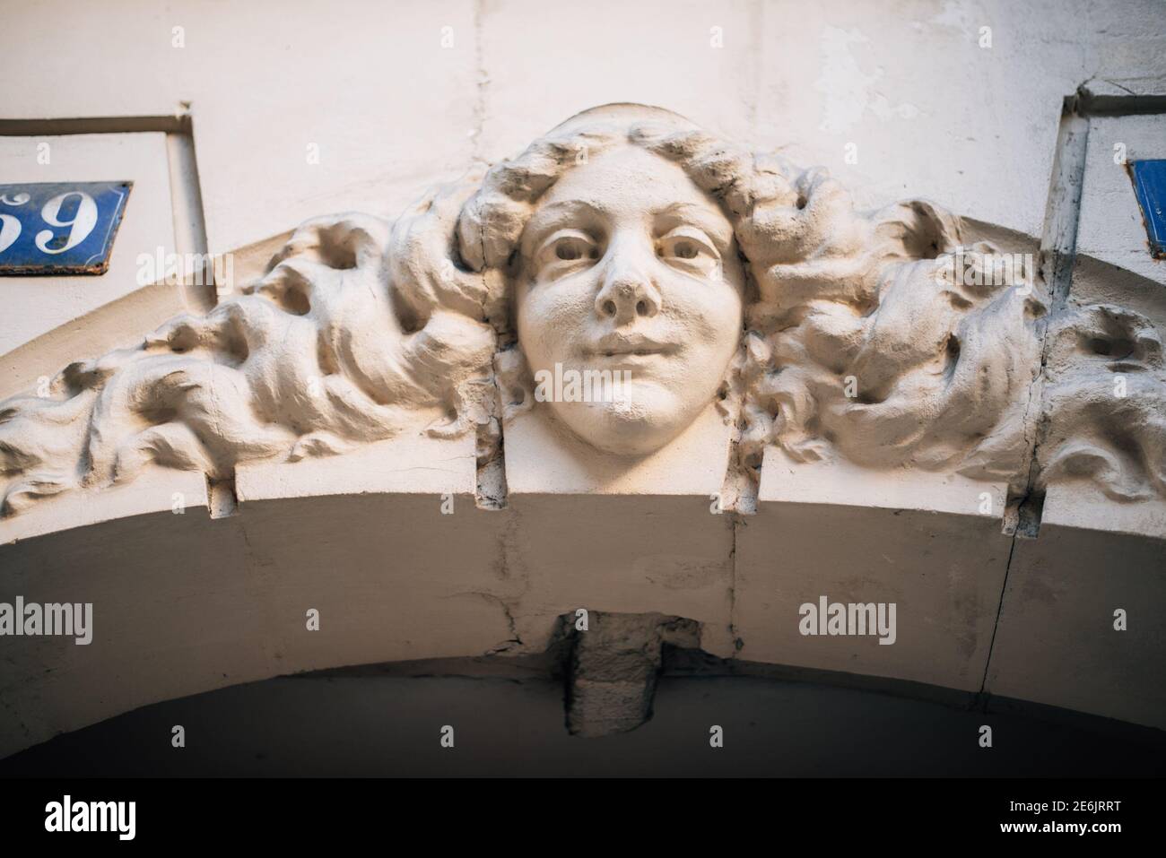 sculpture of a woman’s face over the arch Stock Photo - Alamy