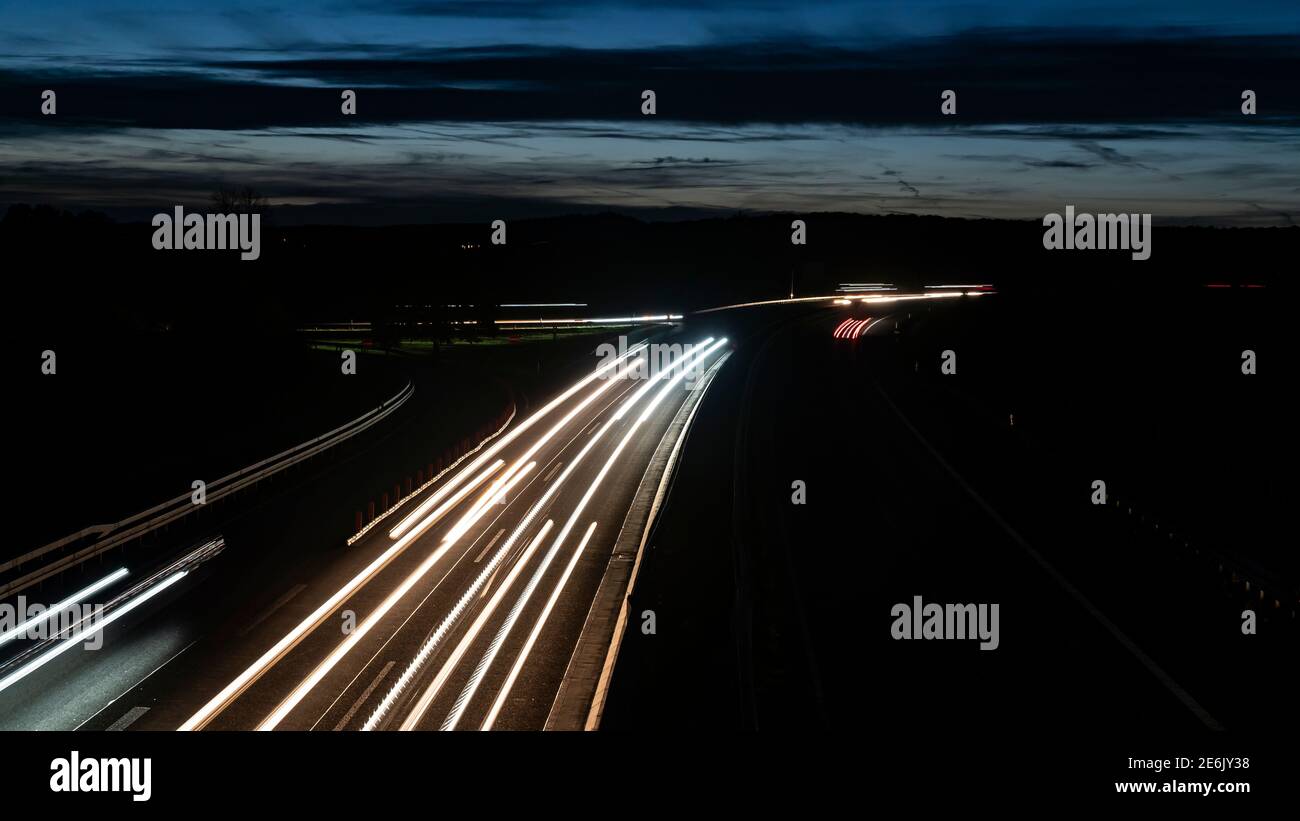 Long exposure from autobahn in germany at night Stock Photo - Alamy