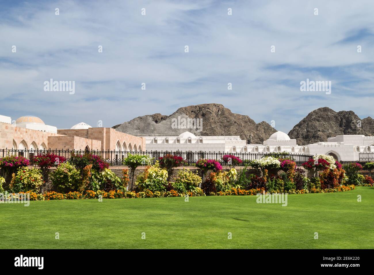 MUSCAT, OMAN - FEBRUARY 9, 2018: Beautiful green grass and colorful ...