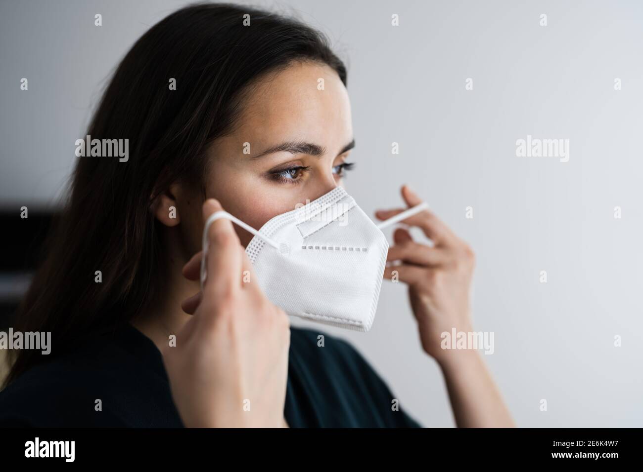 Putting face mask hi-res stock photography and images - Alamy