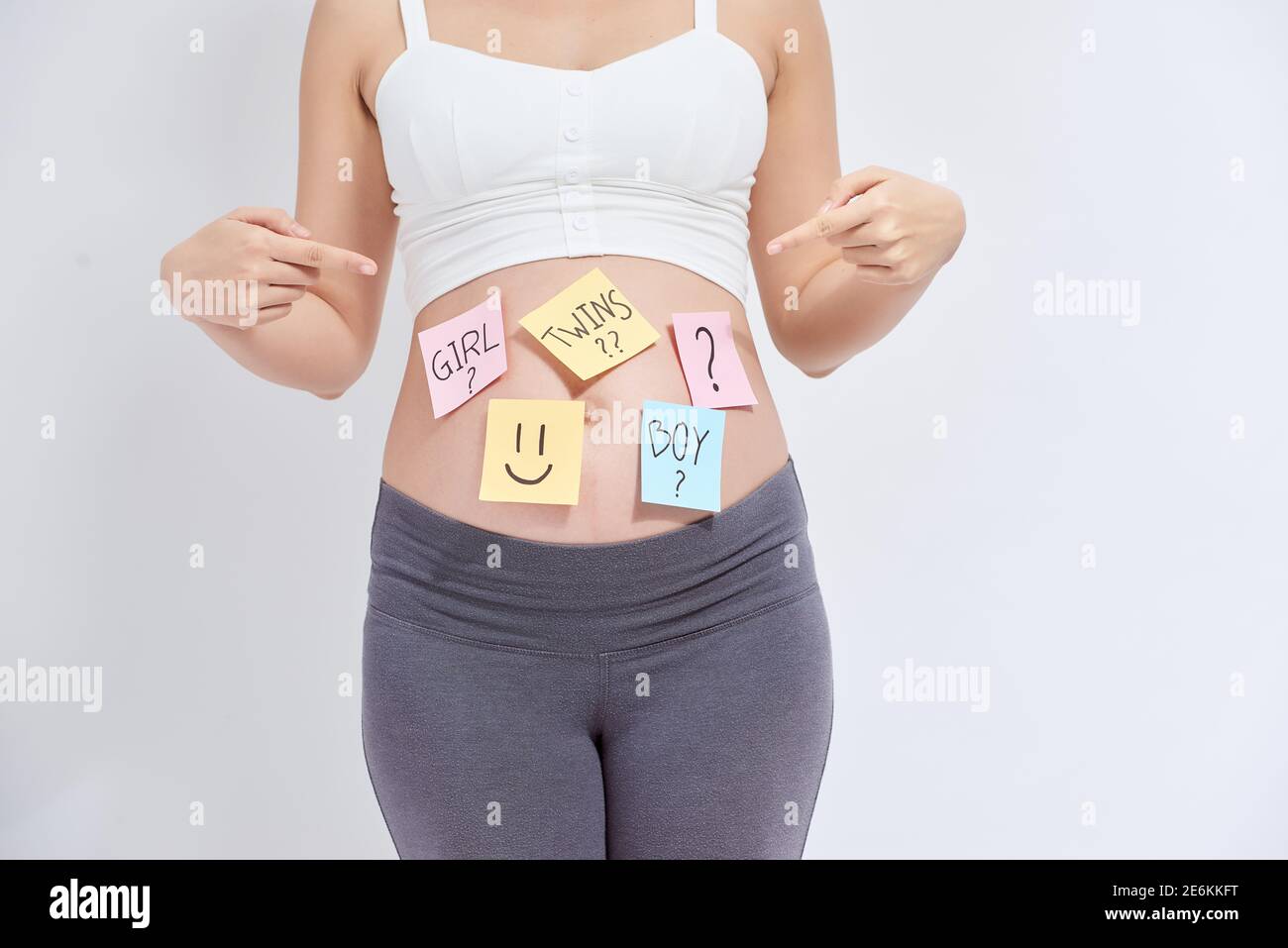 Pregnant woman with stick notes on her belly Stock Photo - Alamy
