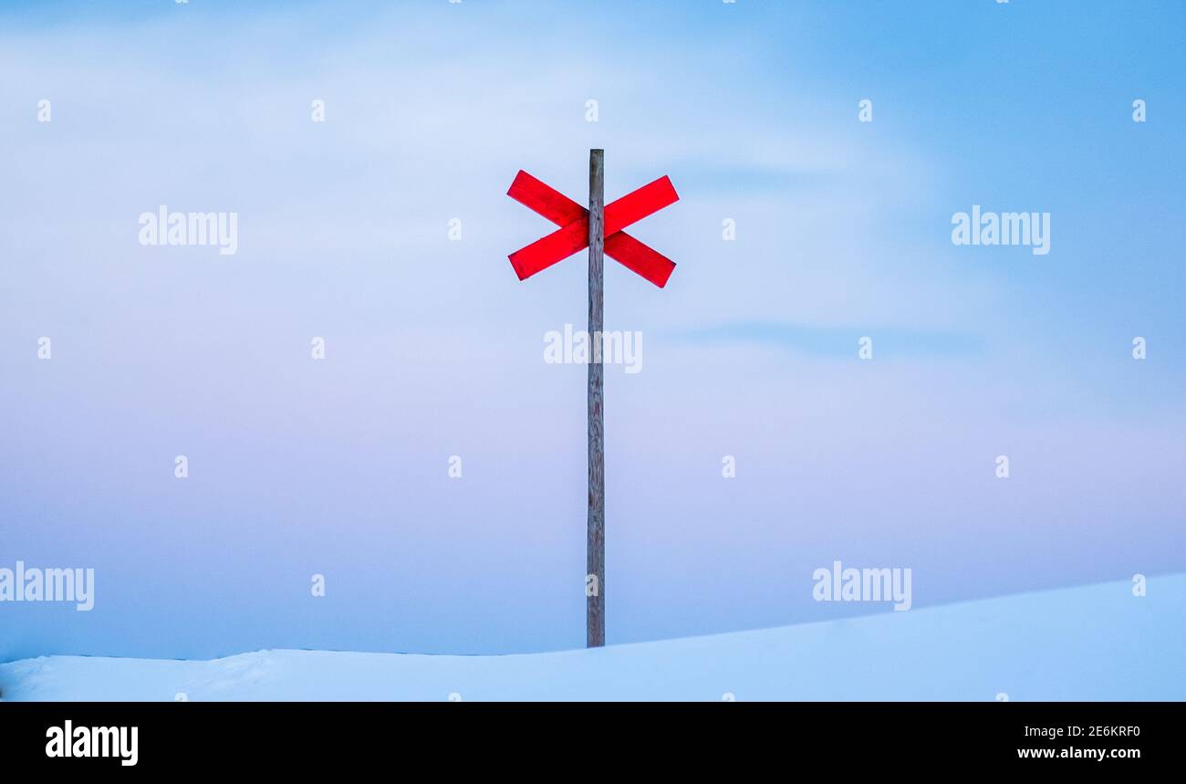 Ski trail red cross sign in the snowy area Stock Photo - Alamy