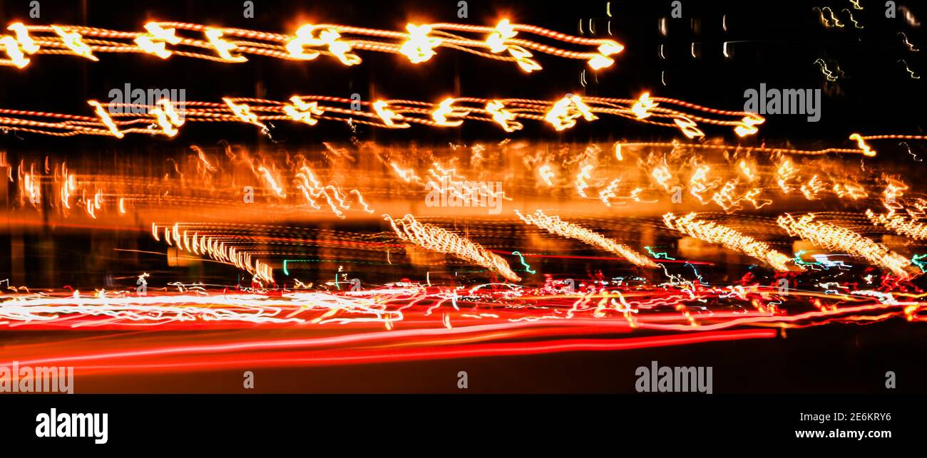 High-speed light tracks of car lights on the highway highway in the ...