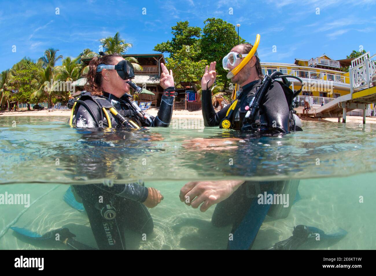 Scuba diver instructor with student during scuba teaching class with ...