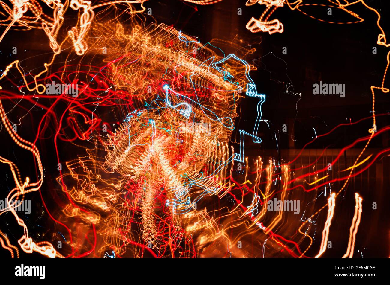 High-speed light tracks of city lights and car headlights on the road ...