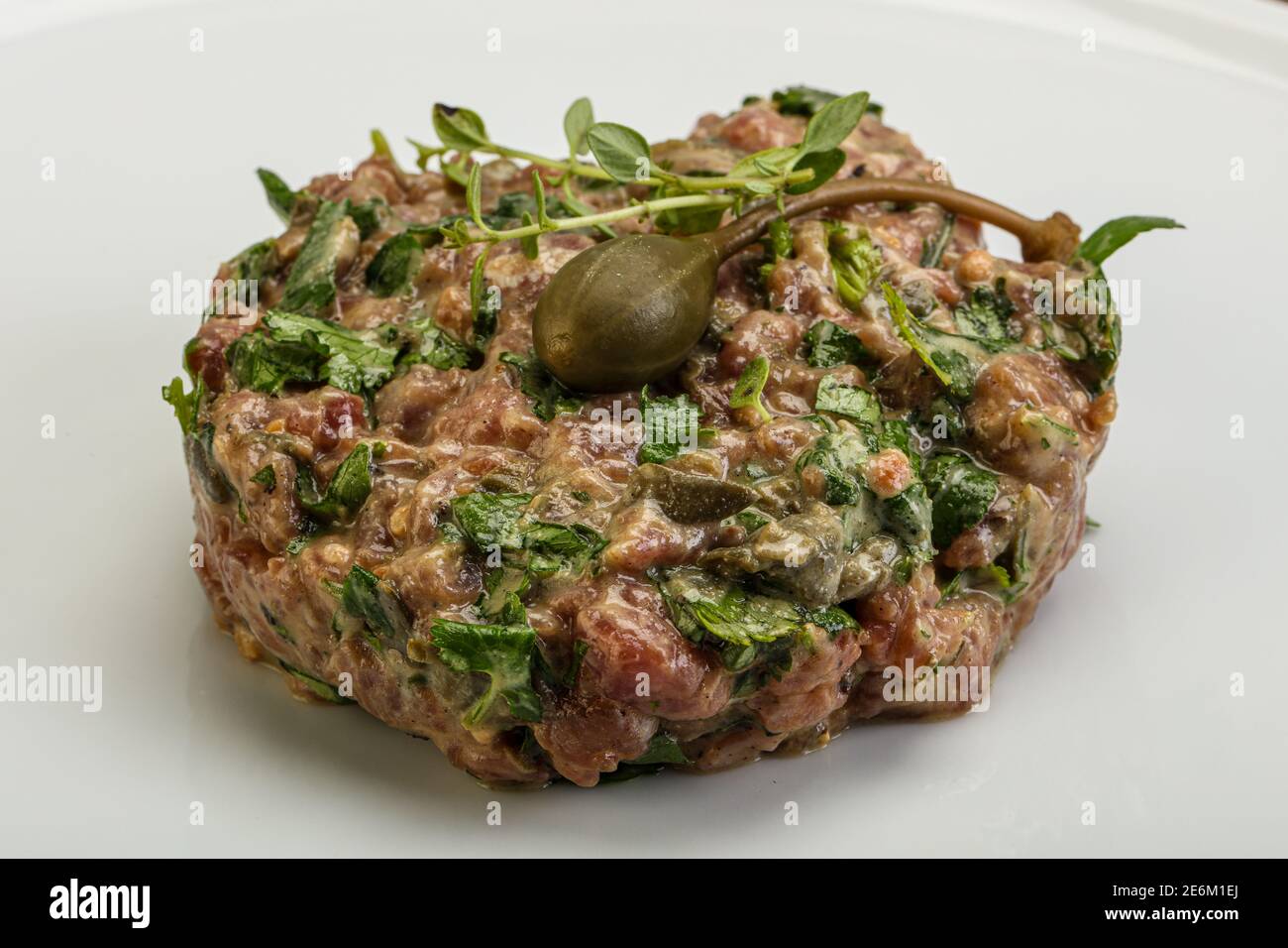 Raw beef tartar snack with capers Stock Photo - Alamy
