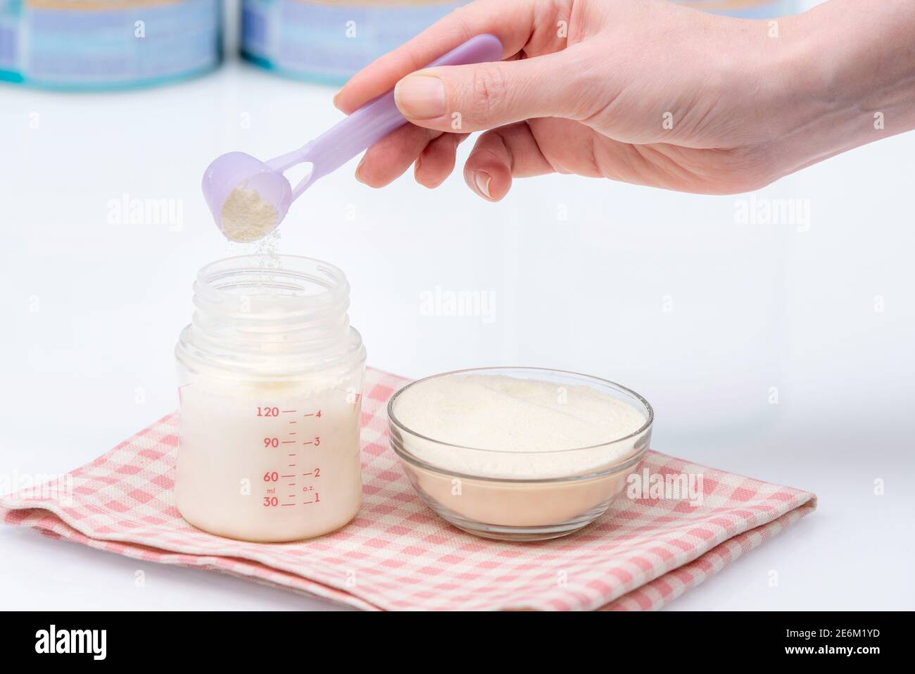 Preparation of mixture baby feeding. Close up of preparing baby formula ...