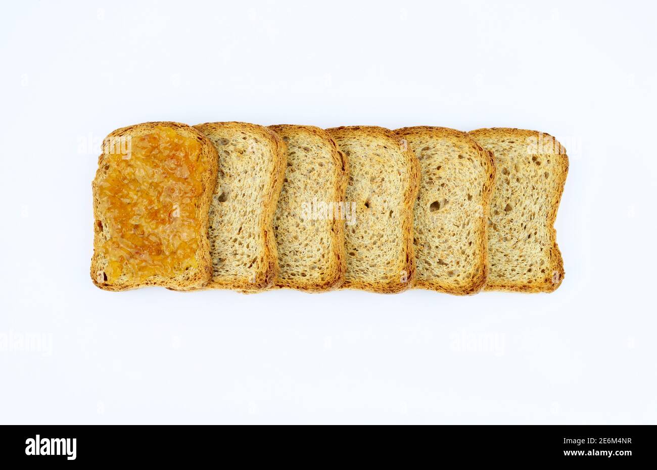 Crispy rusks isolated on white background, one rusk with orange jam ...