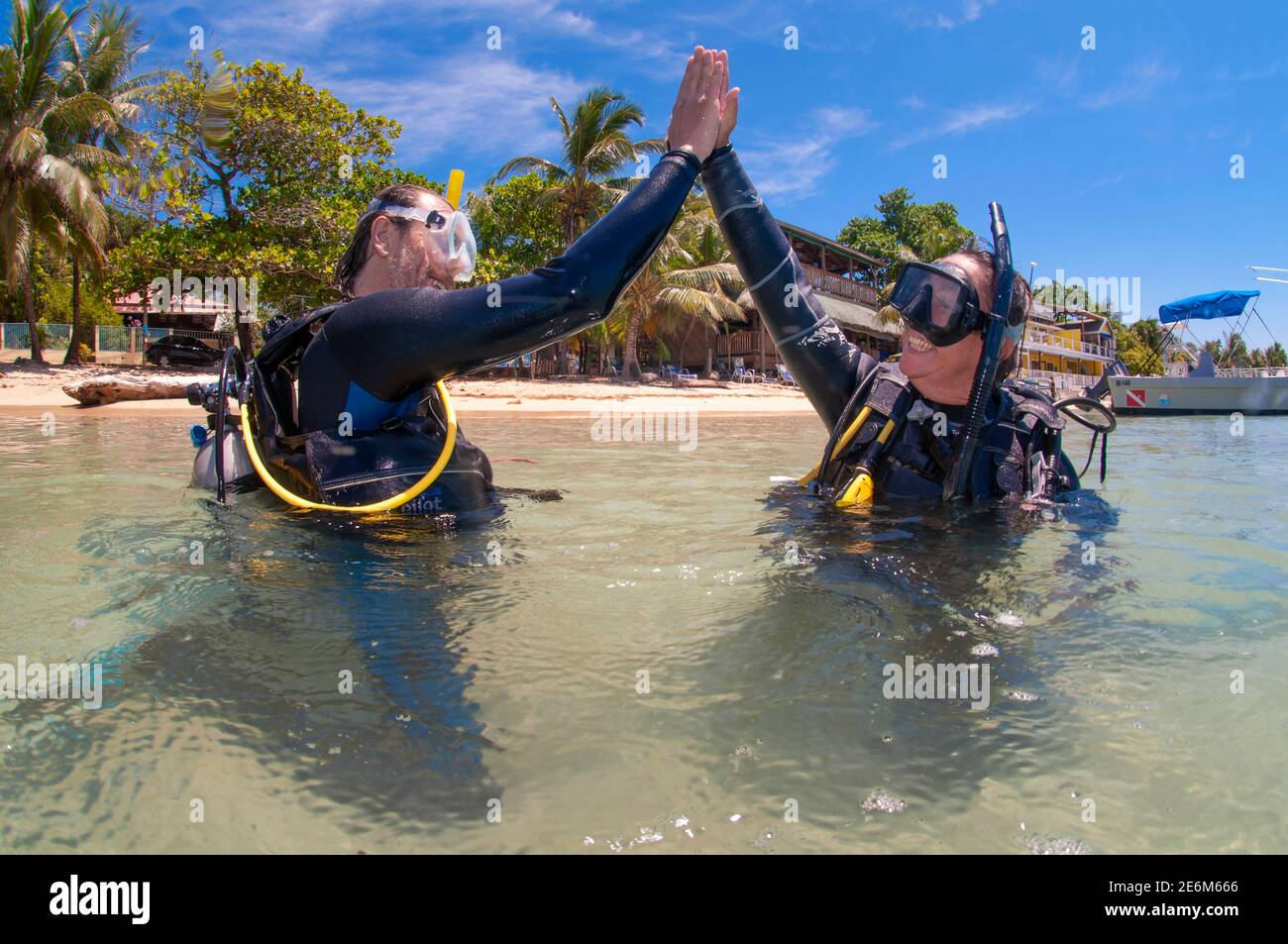 Scuba diver instructor with student during scuba teaching class with ...