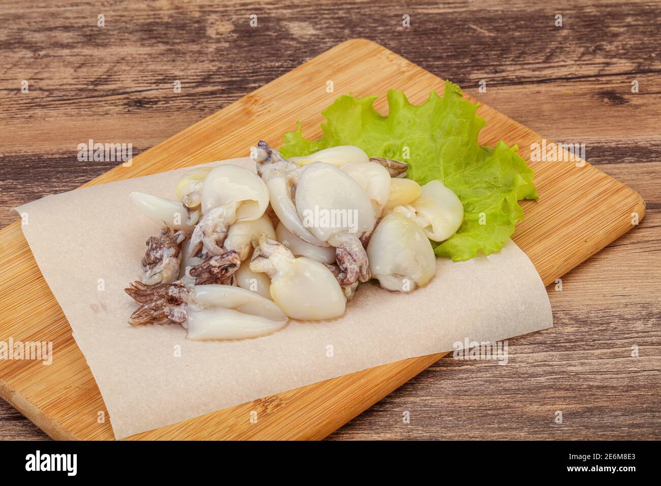 Raw seafood - cuttlefish for cooking over board Stock Photo - Alamy