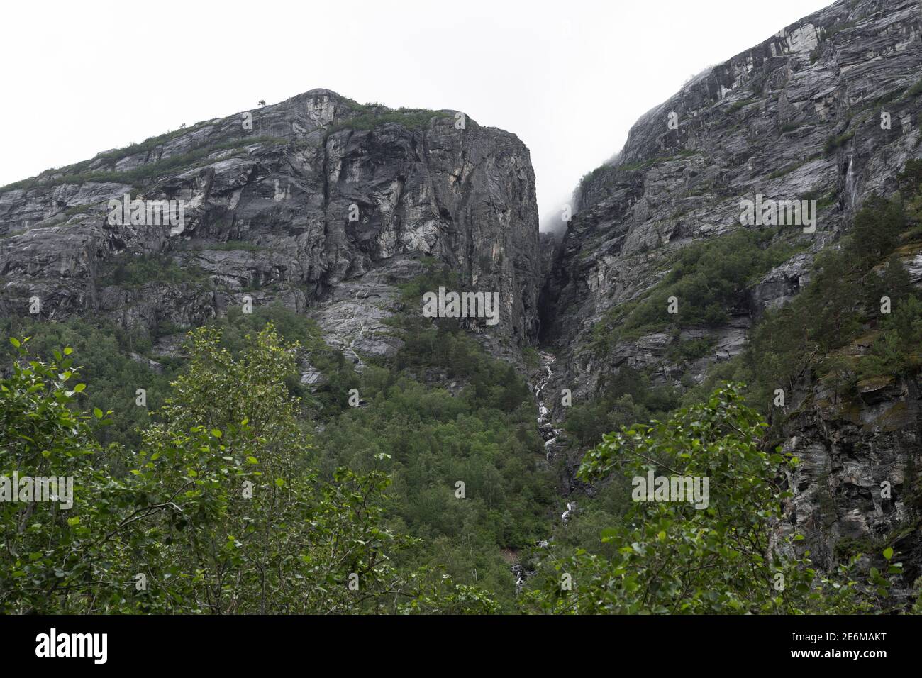 Hiking at the foot of the mountains of Andalsnes, Norway Stock Photo ...