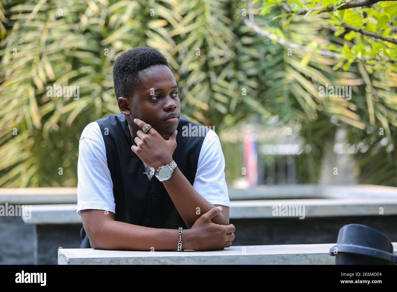 Portrait of young handsome afro black man posing outdoor Stock Photo - Alamy