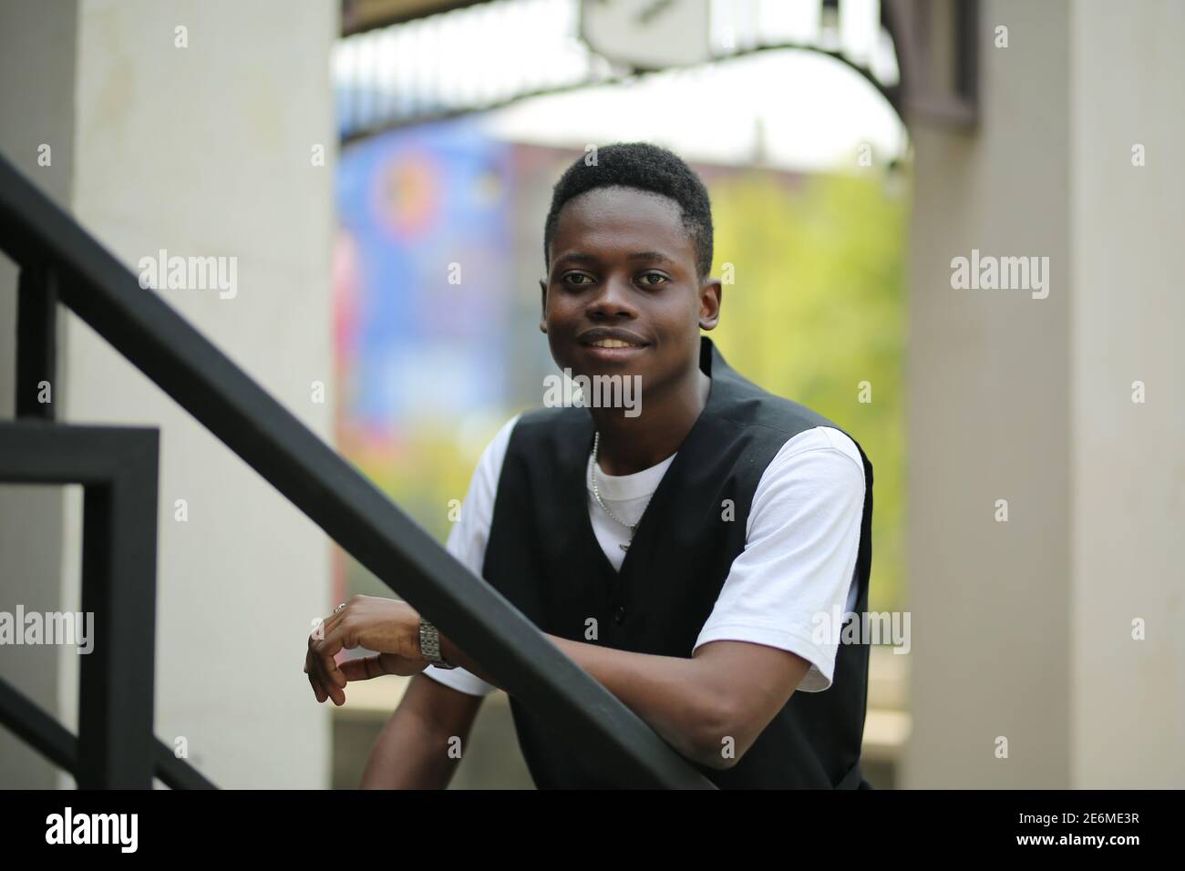 Portrait of young handsome afro black man posing outdoor Stock Photo - Alamy
