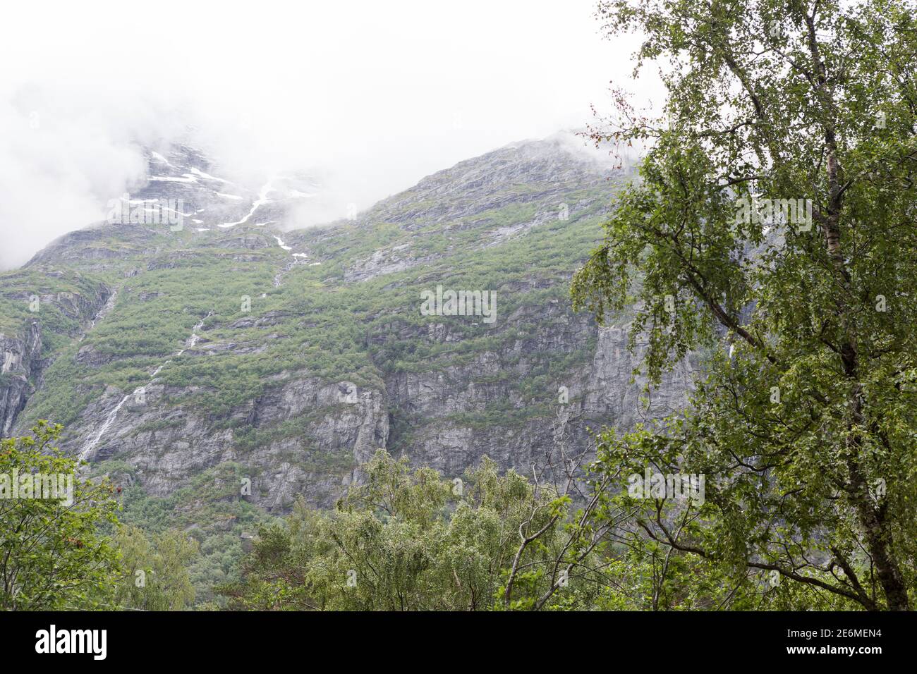 Hiking at the foot of the mountains of Andalsnes, Norway Stock Photo ...