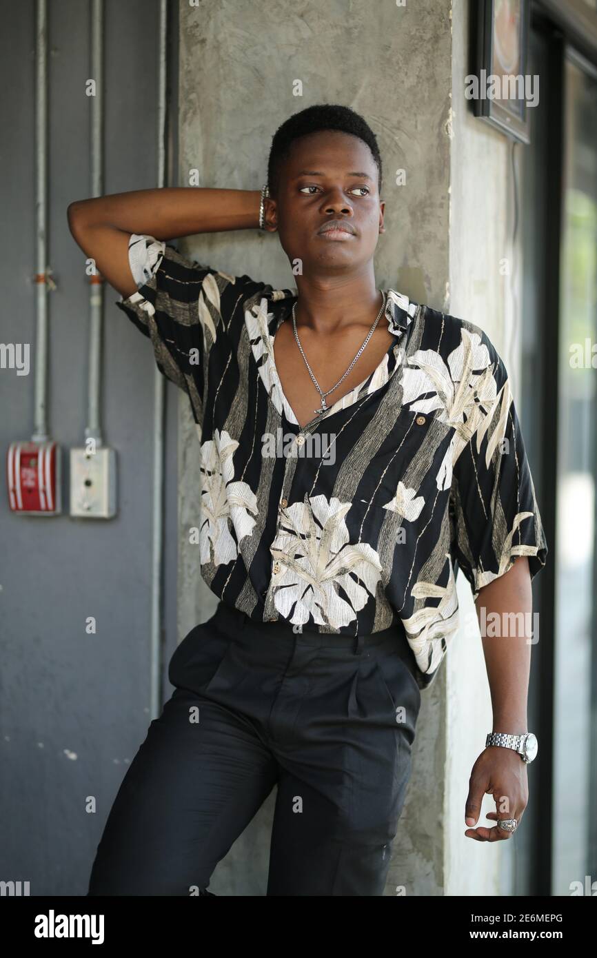 Portrait of young handsome afro black man posing outdoor Stock Photo - Alamy