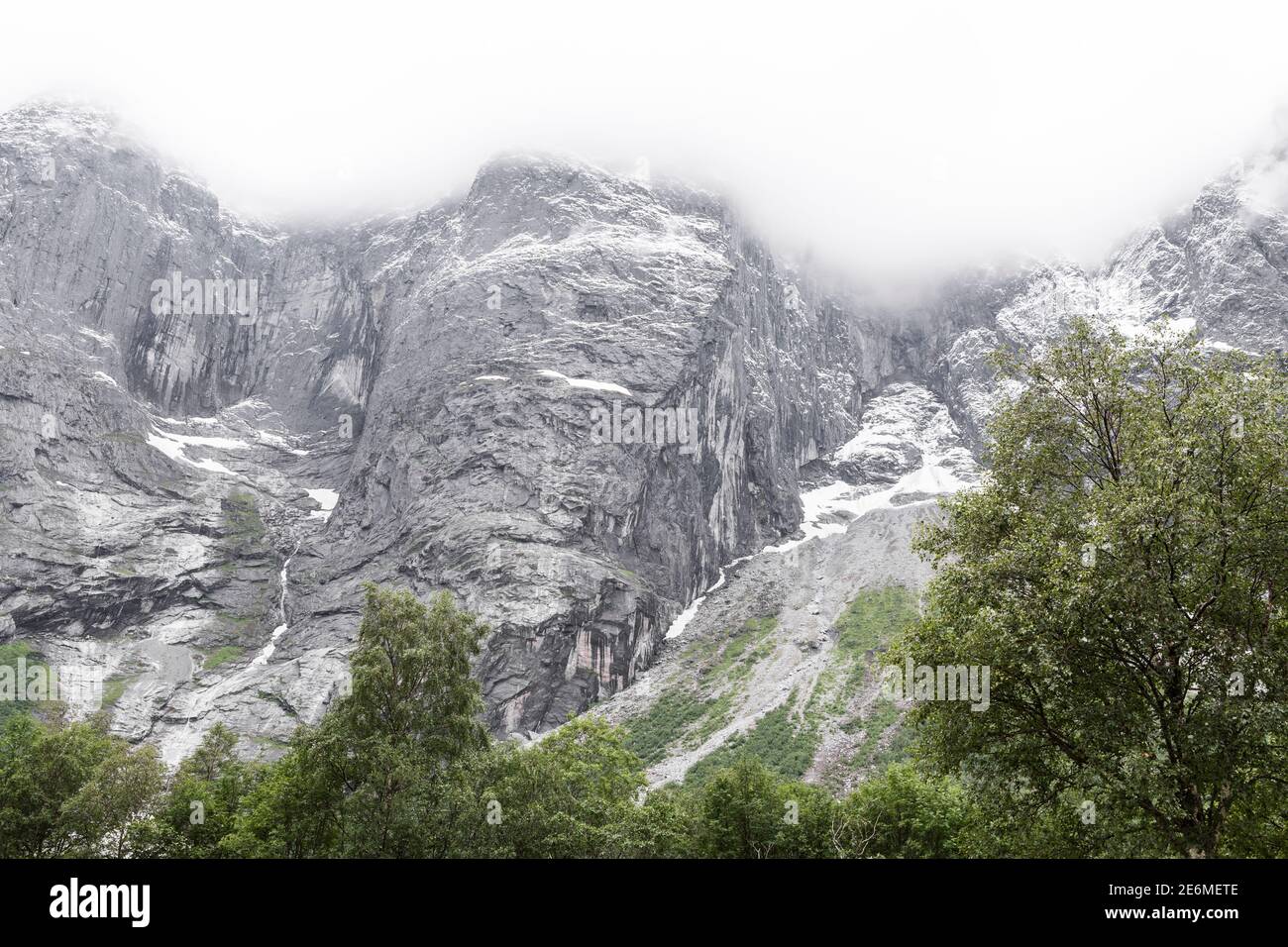 Hiking at the foot of the mountains of Andalsnes, Norway Stock Photo ...