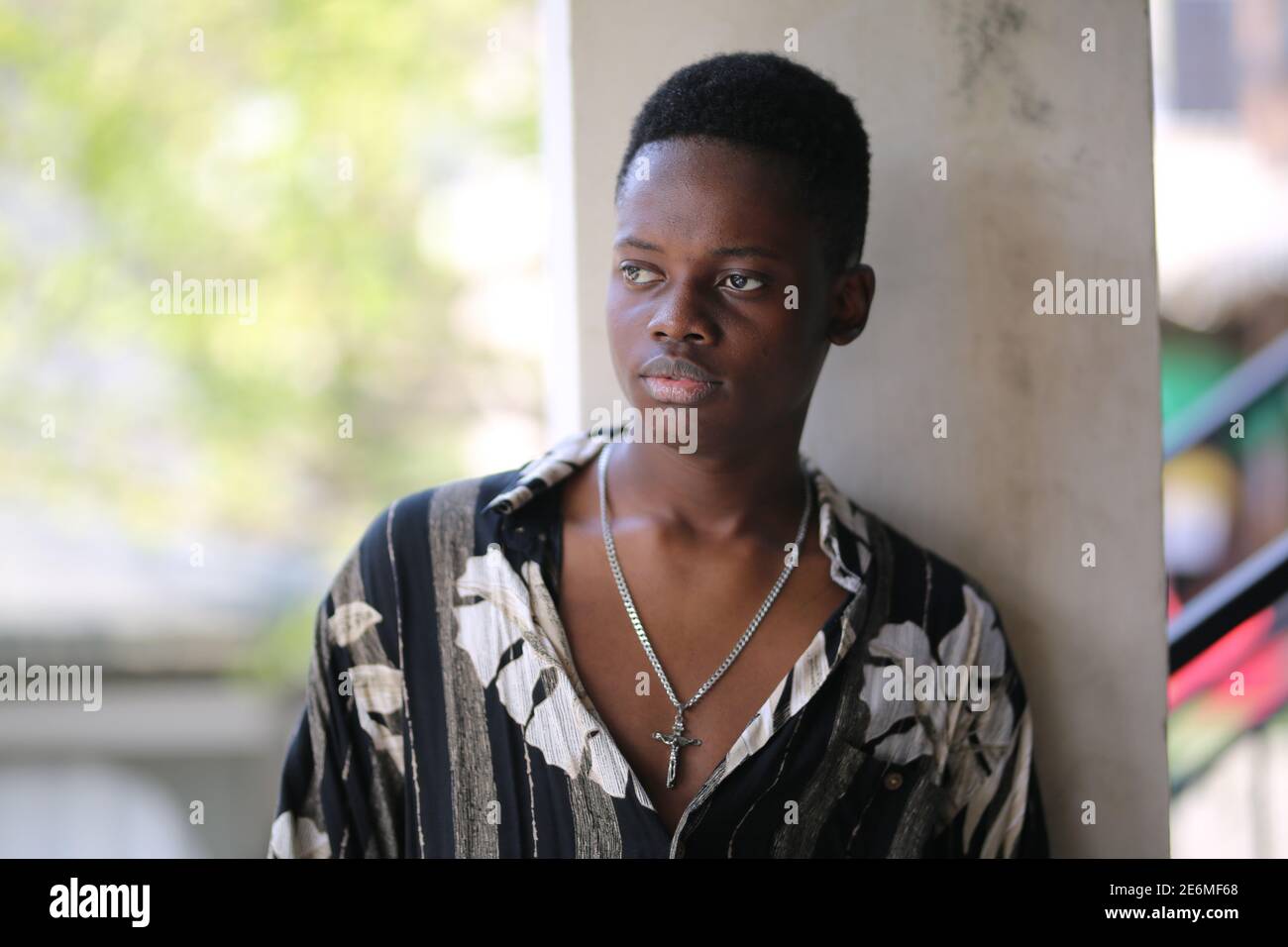 Portrait of young handsome afro black man posing outdoor Stock Photo - Alamy