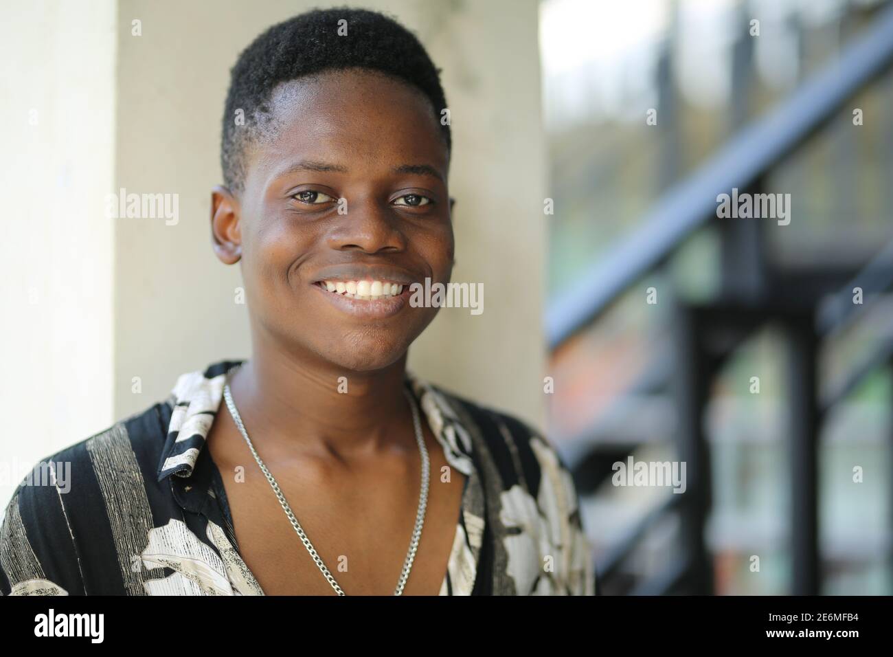 Portrait of young handsome afro black man posing outdoor Stock Photo - Alamy