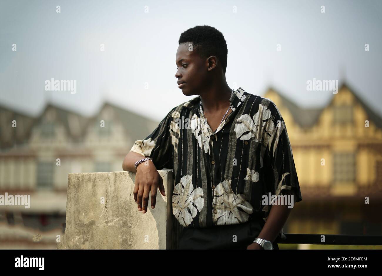 Portrait of young handsome afro black man posing outdoor Stock Photo - Alamy