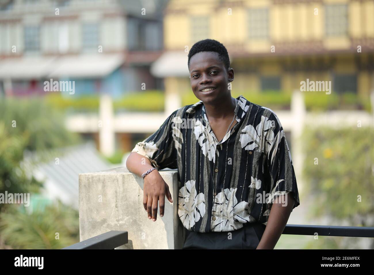 Portrait of young handsome afro black man posing outdoor Stock Photo - Alamy