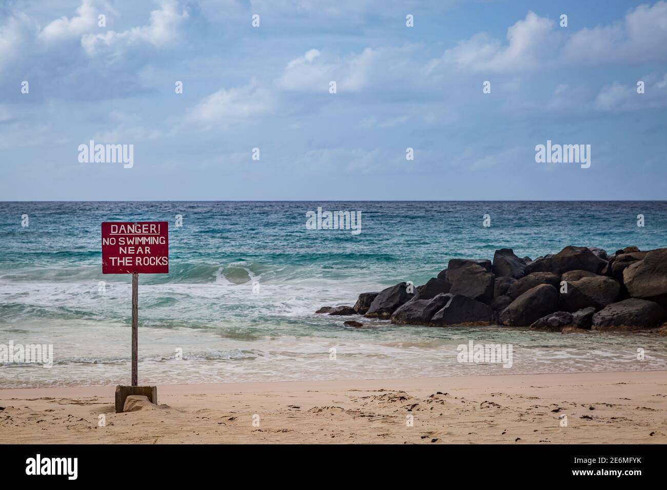 Warning sign danger rocks waves hi-res stock photography and images - Alamy