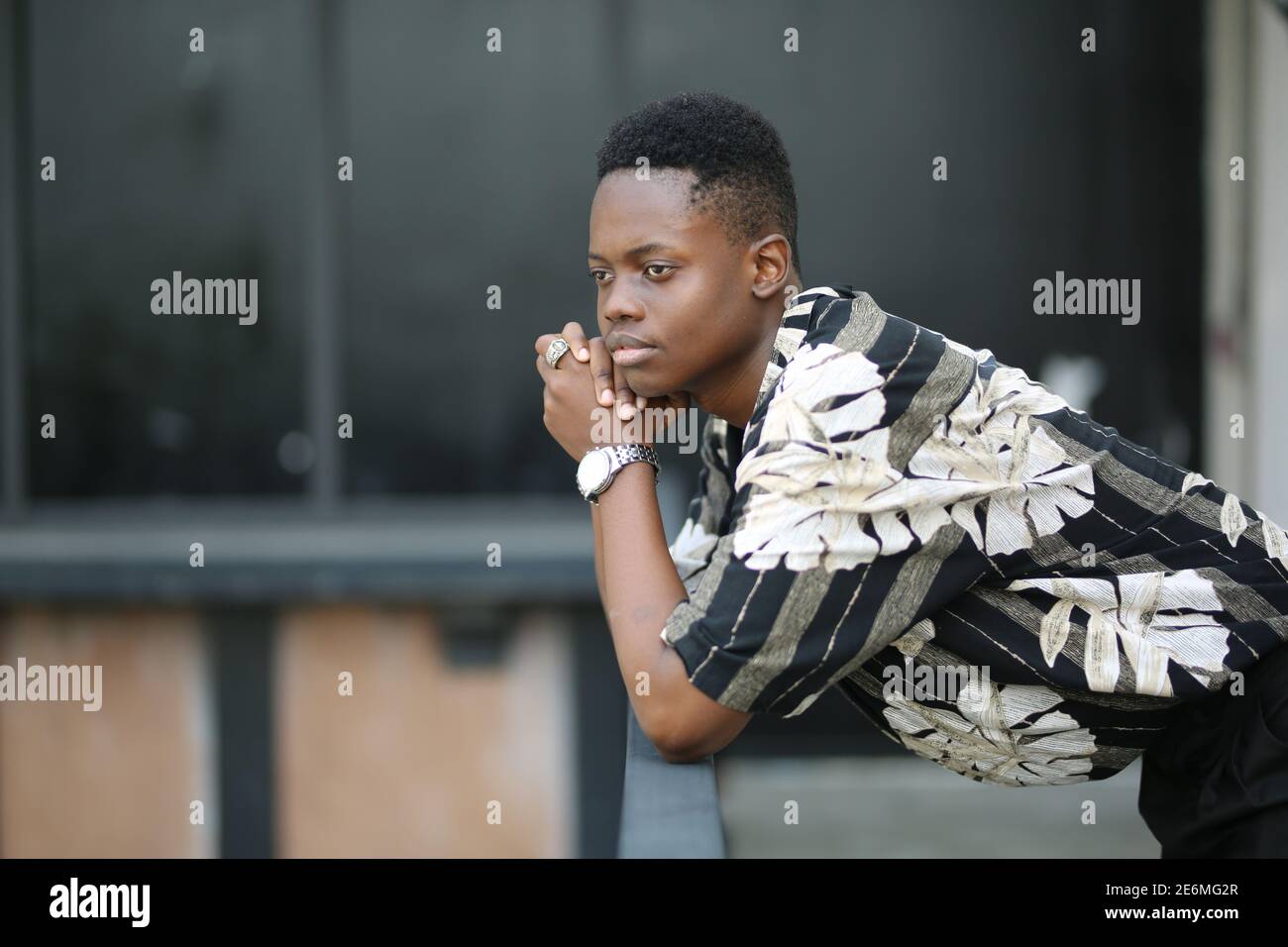 Portrait of young handsome afro black man posing outdoor Stock Photo - Alamy