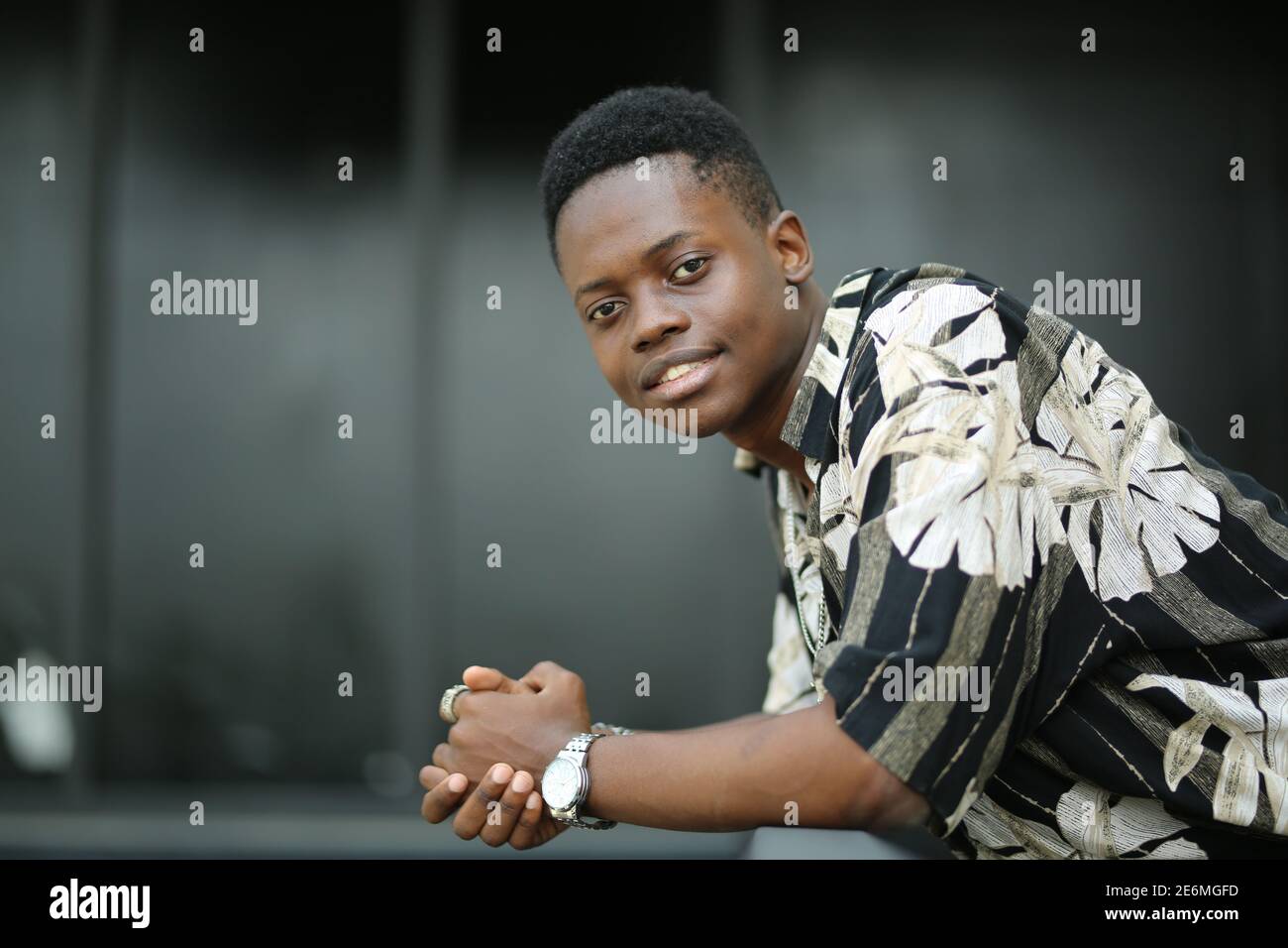Portrait of young handsome afro black man posing outdoor Stock Photo - Alamy