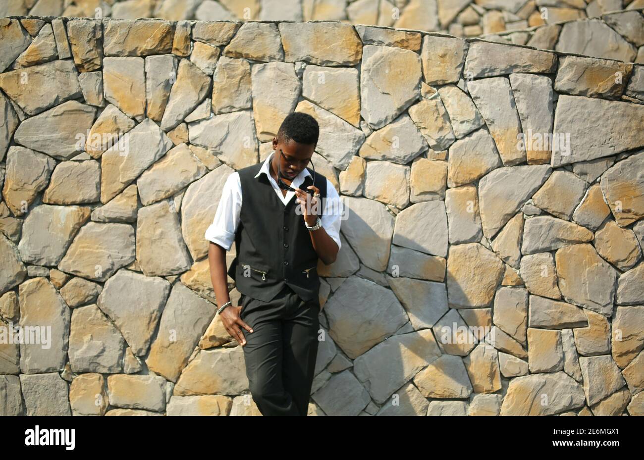 Portrait of young handsome afro black man posing outdoor Stock Photo - Alamy