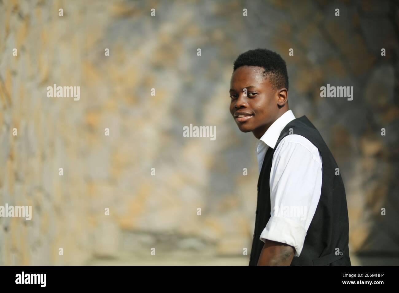 Portrait of young handsome afro black man posing outdoor Stock Photo - Alamy