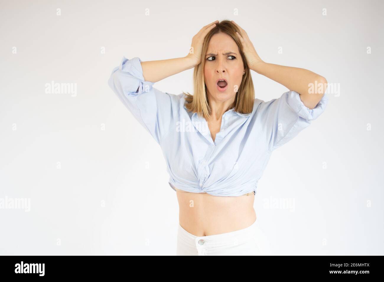 Shocked horrified blonde woman isolated hi-res stock photography and images - Alamy