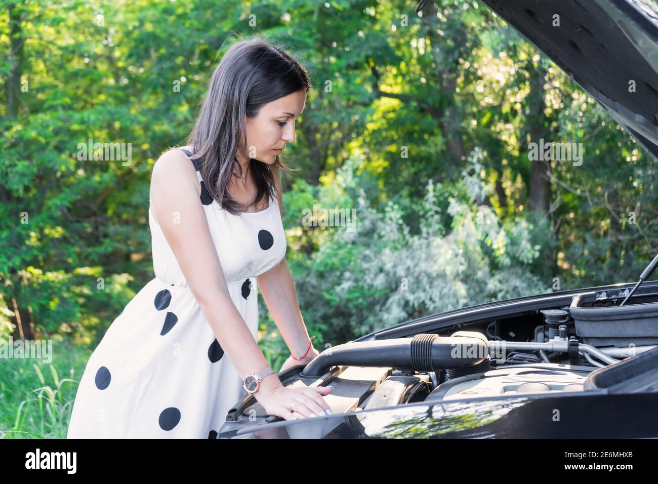 Woman fixing car engine hi-res stock photography and images - Alamy