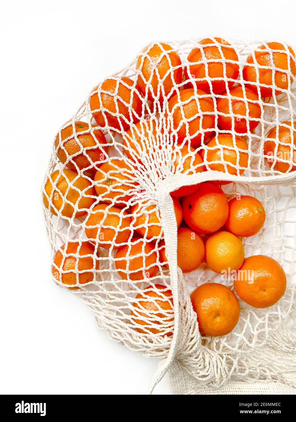 Mesh bag of fresh oranges healthy citrus fruits from on white ...