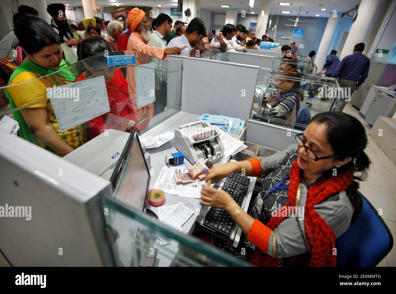 Indian bank cashier hi-res stock photography and images - Alamy
