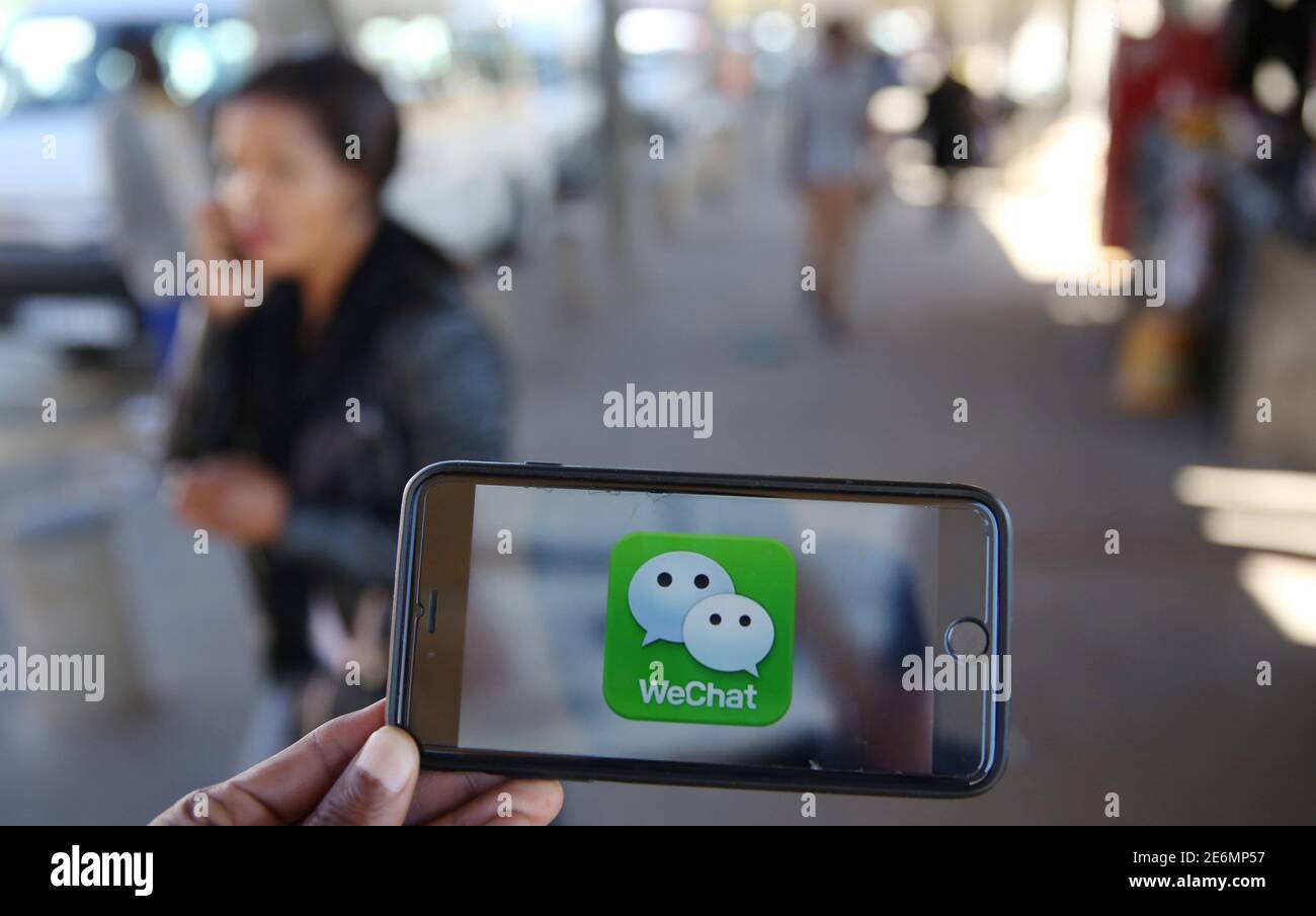 Wechat logo on a phone hi-res stock photography and images - Alamy