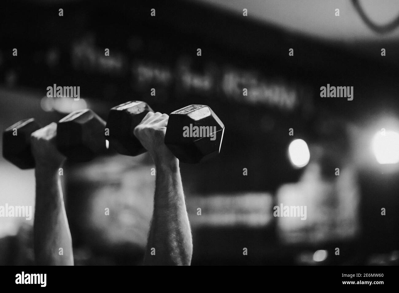 weights and fitness accessories in gym monochrome Stock Photo - Alamy
