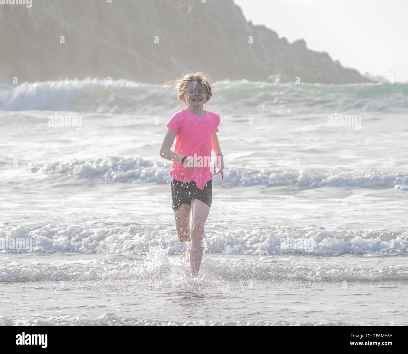 Running in the waves hi-res stock photography and images - Alamy