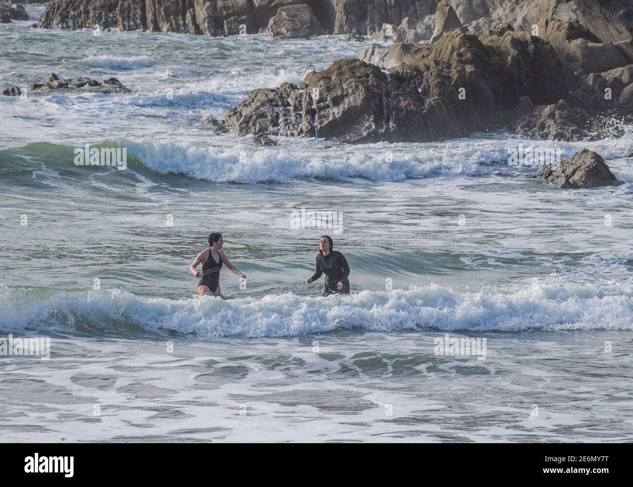 Girls playing in surf hi-res stock photography and images - Alamy