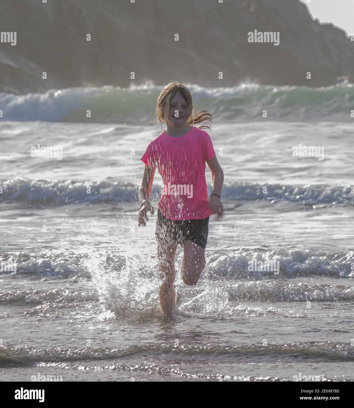 Running in the waves hi-res stock photography and images - Alamy