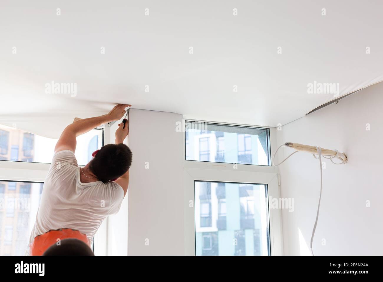 Installation of stretch ceiling. Niche for stretch ceiling. Stretch ...