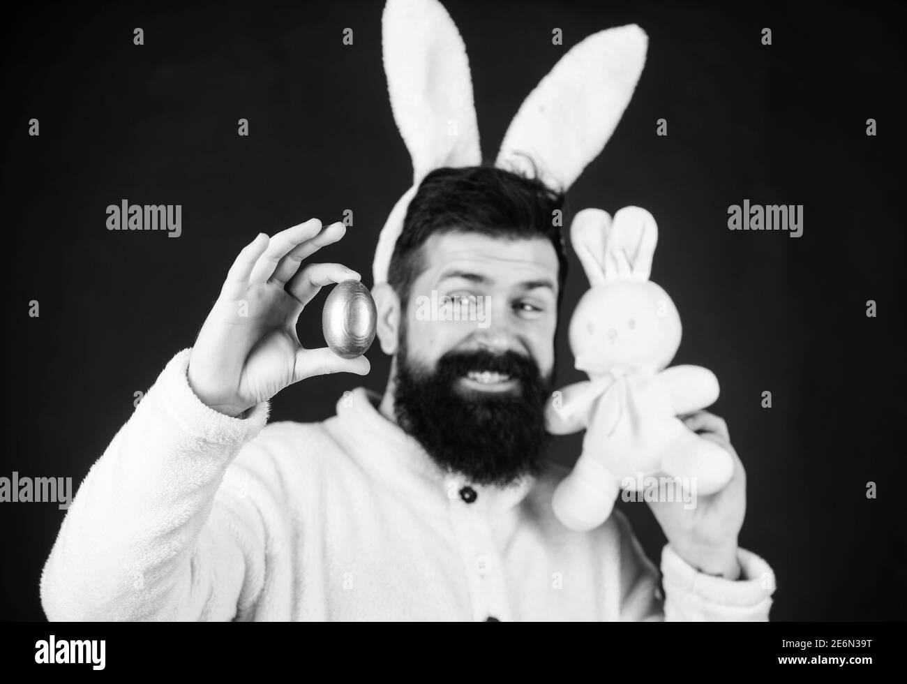 Easter rabbit. Man wearing rabbit suit. Funny bunny man with easter egg ...