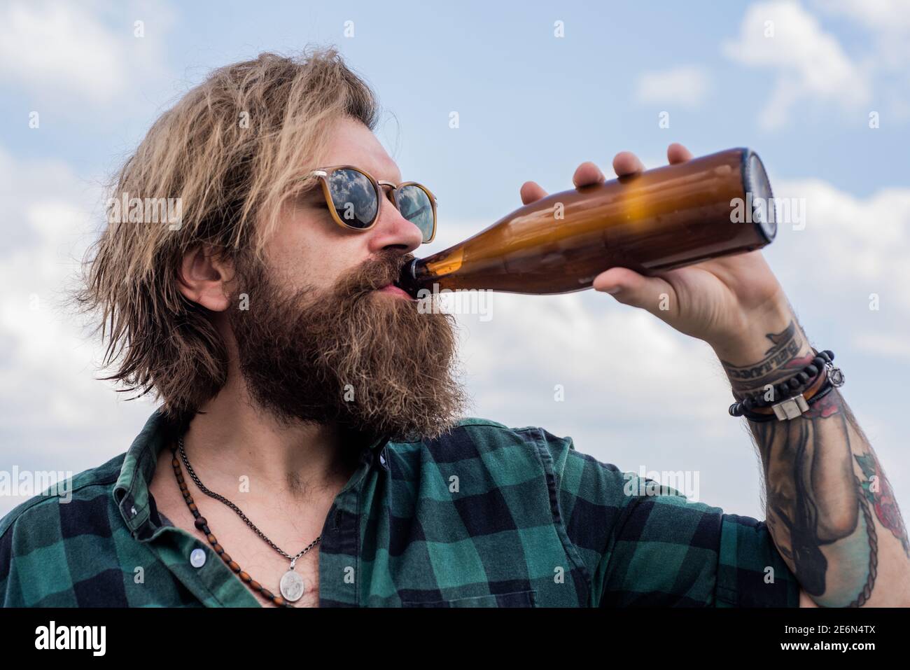 thirsty brutal handsome man with moustache drinking water. water ...