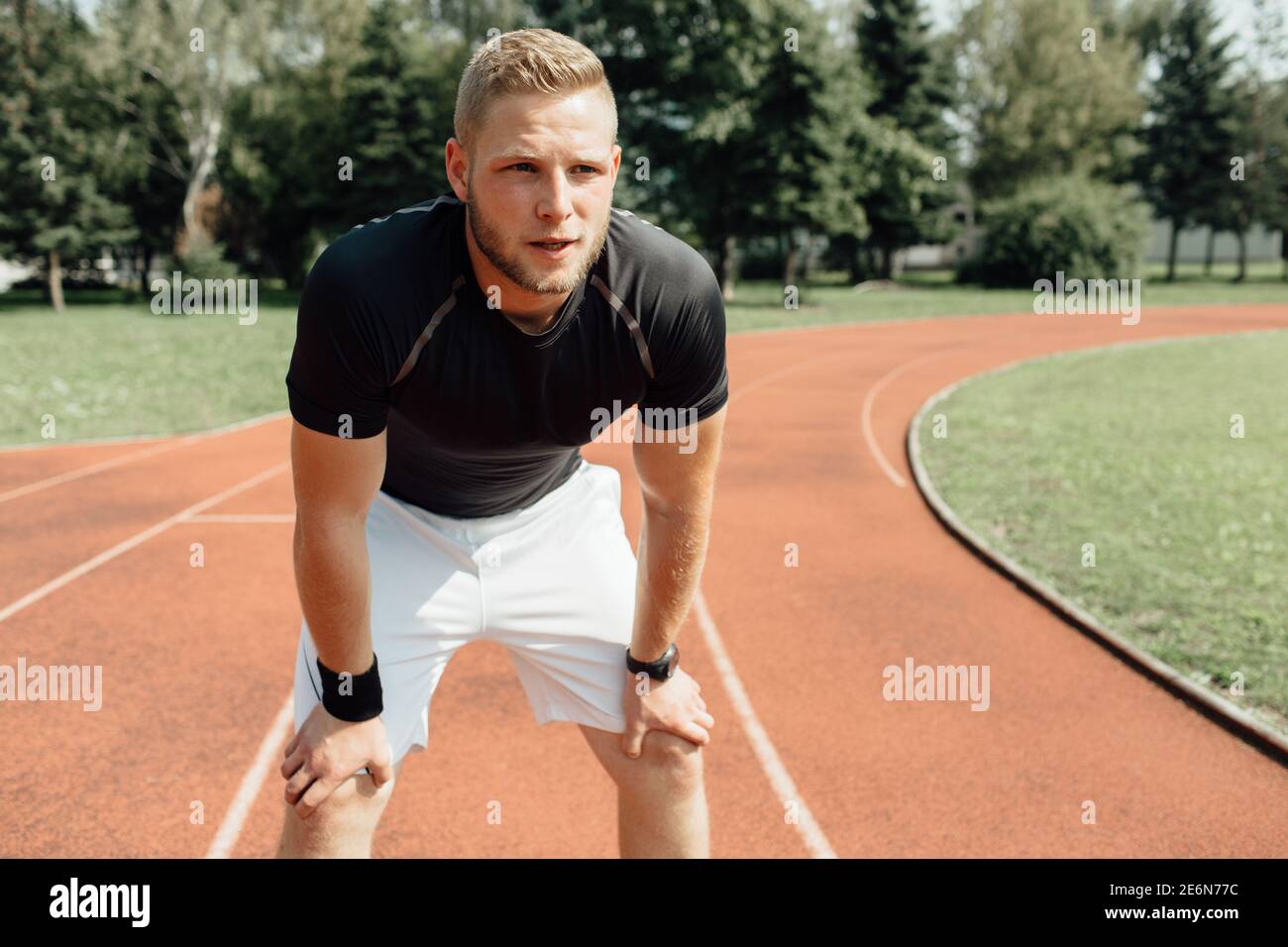 Tired runner bent over hi-res stock photography and images - Alamy