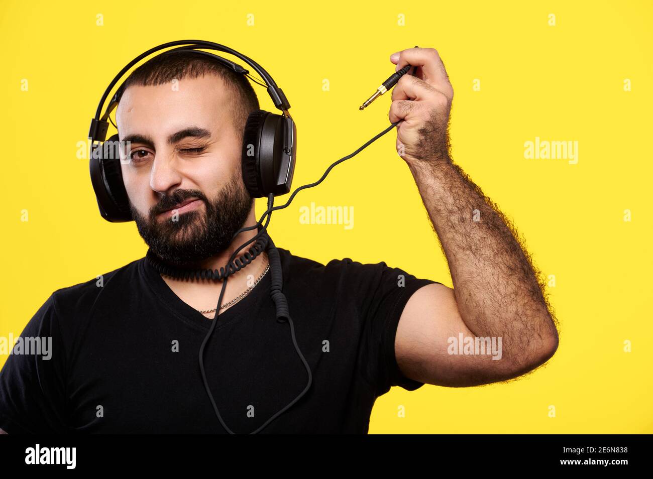 Funny funny dj musician with headphones listens to music pledging by ...