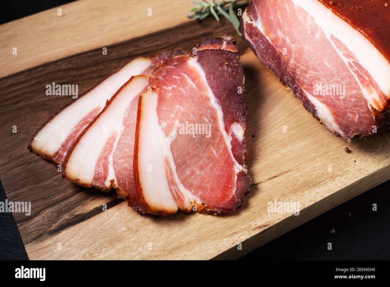 Food concept Artisan Fresh smoked Bacon on wood cutting board with copy ...
